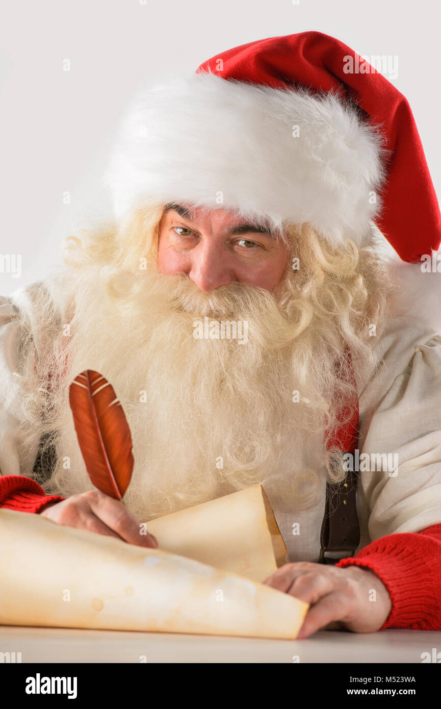 Real Santa Claus writing list of gifts or responding to children's ...