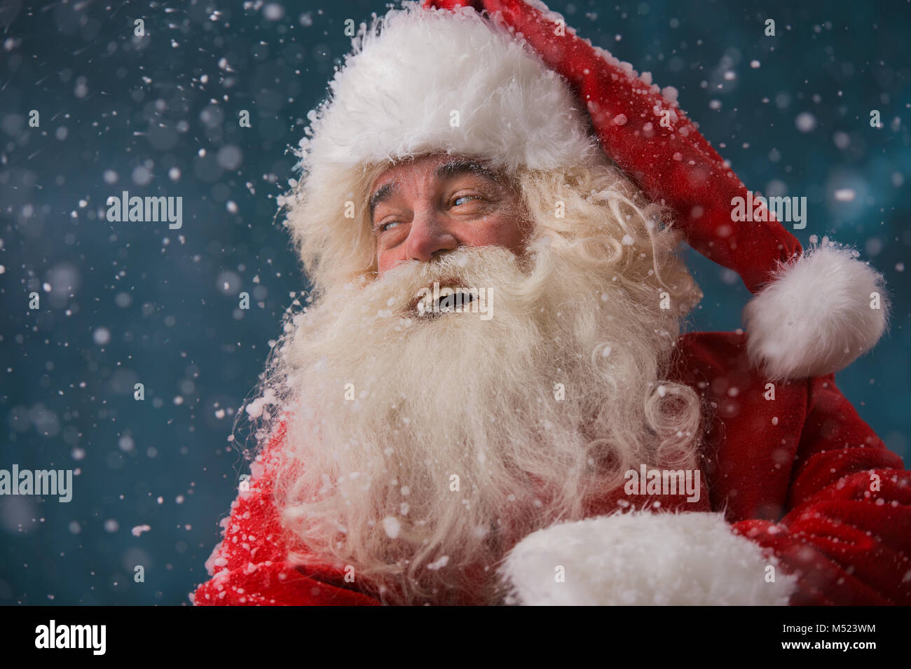 Happy Santa Claus laughing while standing outdoors at North Pole Stock ...
