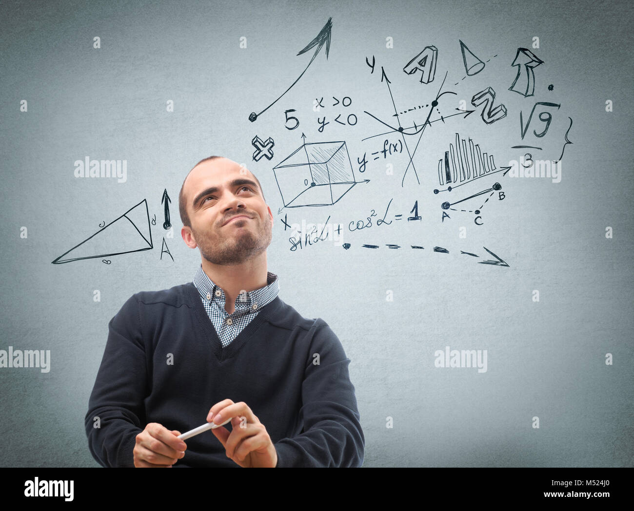 Thinking man against desk with formulas Stock Photo - Alamy