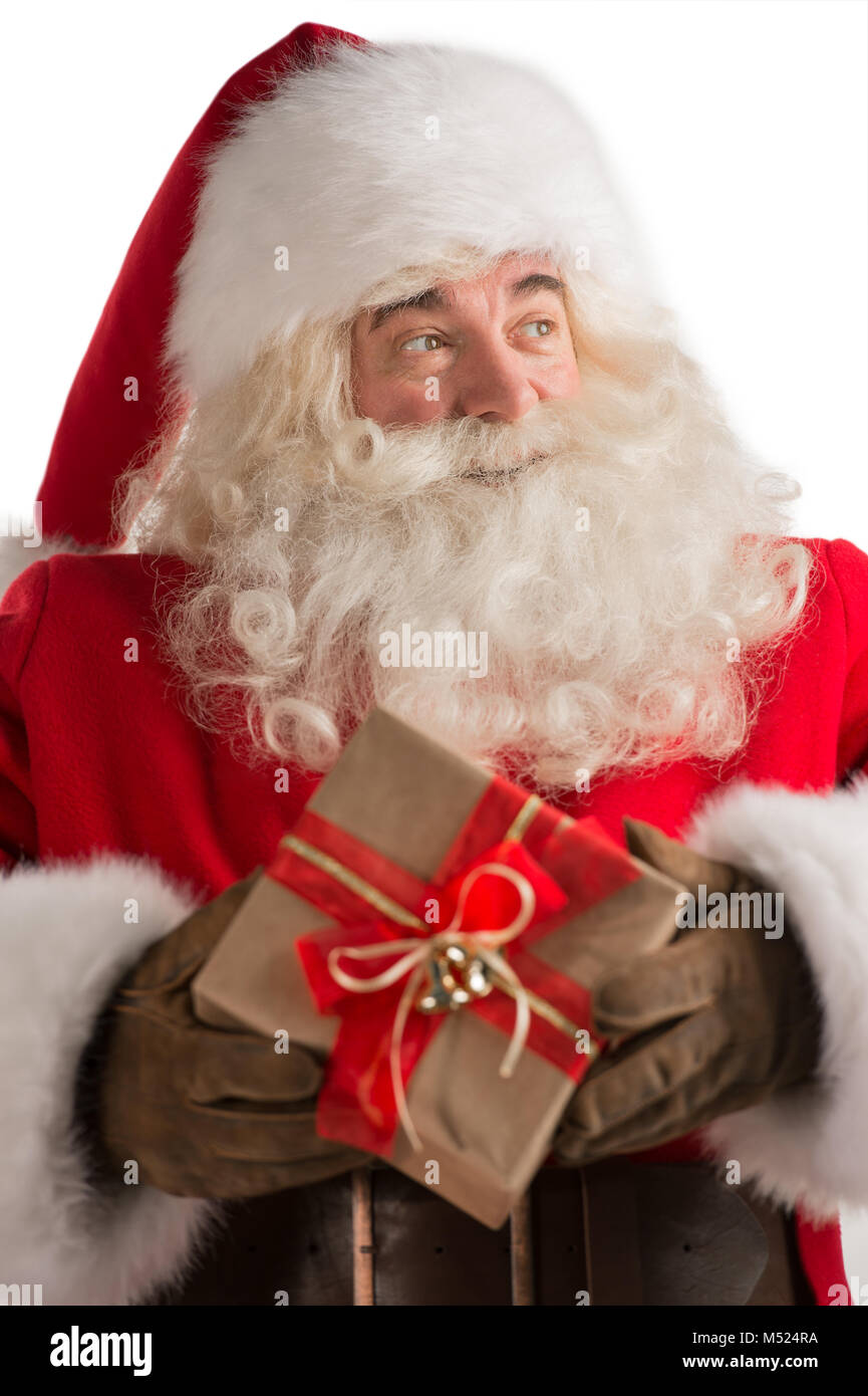 Portrait of kind Santa Claus with christmas present isolated on white ...