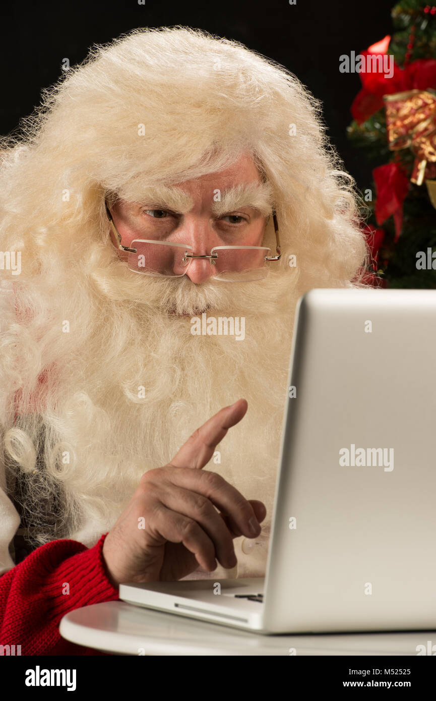 Santa Claus working on computer and having great idea. Idea gesture ...
