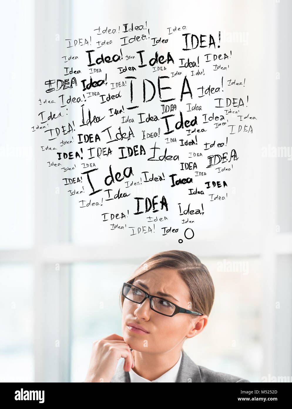 Idea concept. Young business woman with idea signs overhead Stock Photo ...
