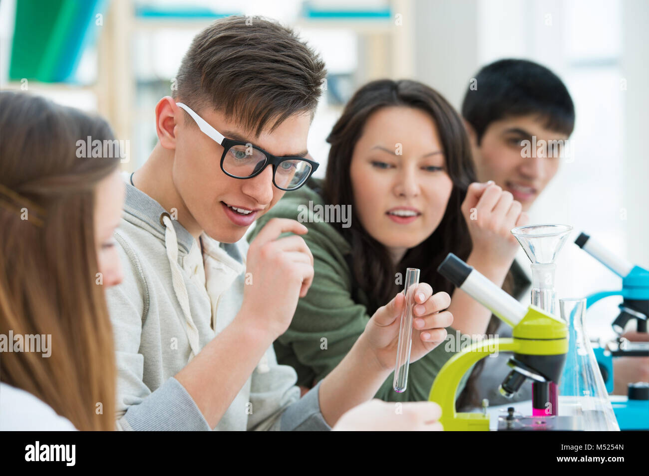 High School students. Group of students working together at laboratory ...