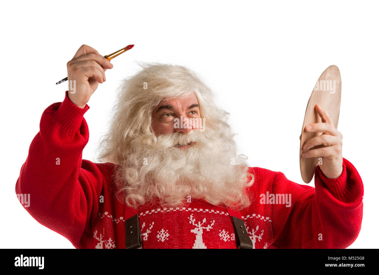 Portrait of Santa Claus painting with brush and palette isolated on ...