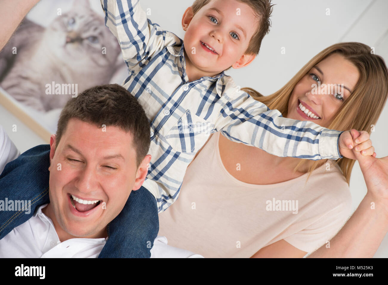 Beautiful happy family having fun at home Stock Photo - Alamy