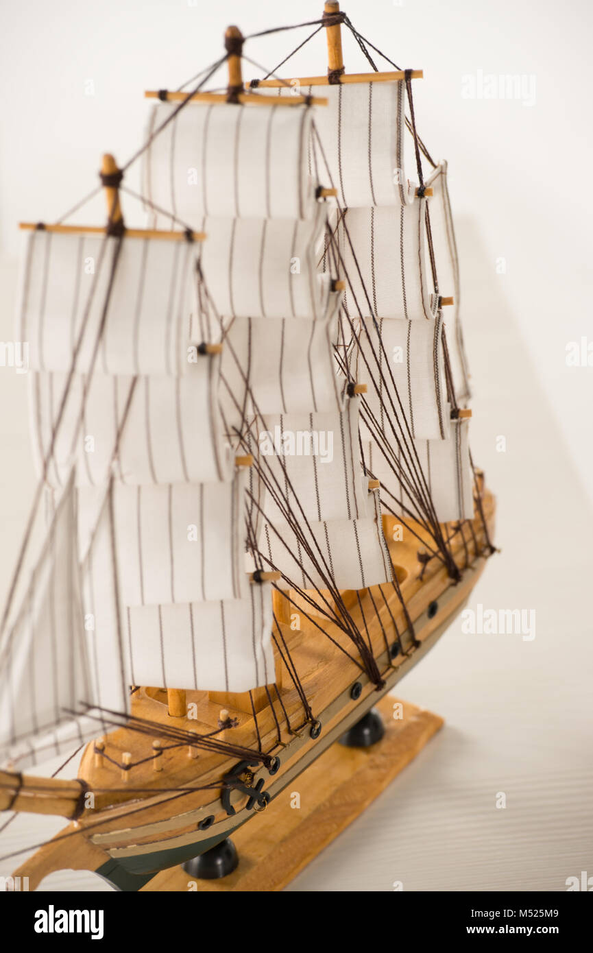 Wooden ship toy model on white table against white background Stock ...