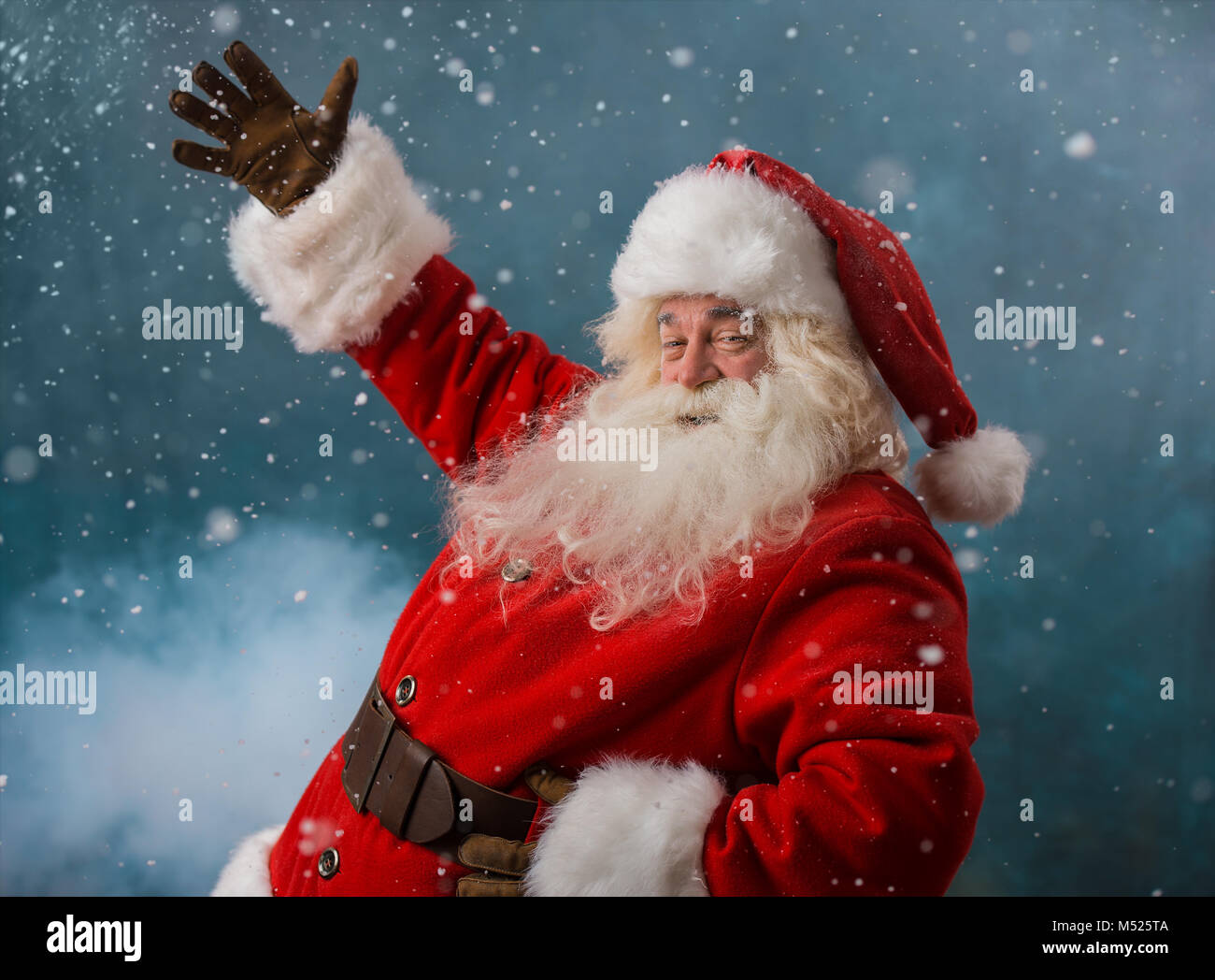 Santa Claus welcoming to the North Pole standing outdoors in snowfall ...