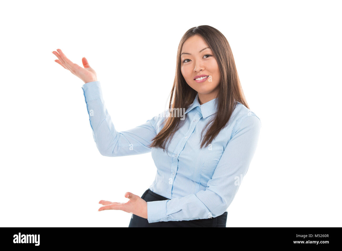 Excited business woman pointing at your product against white ...