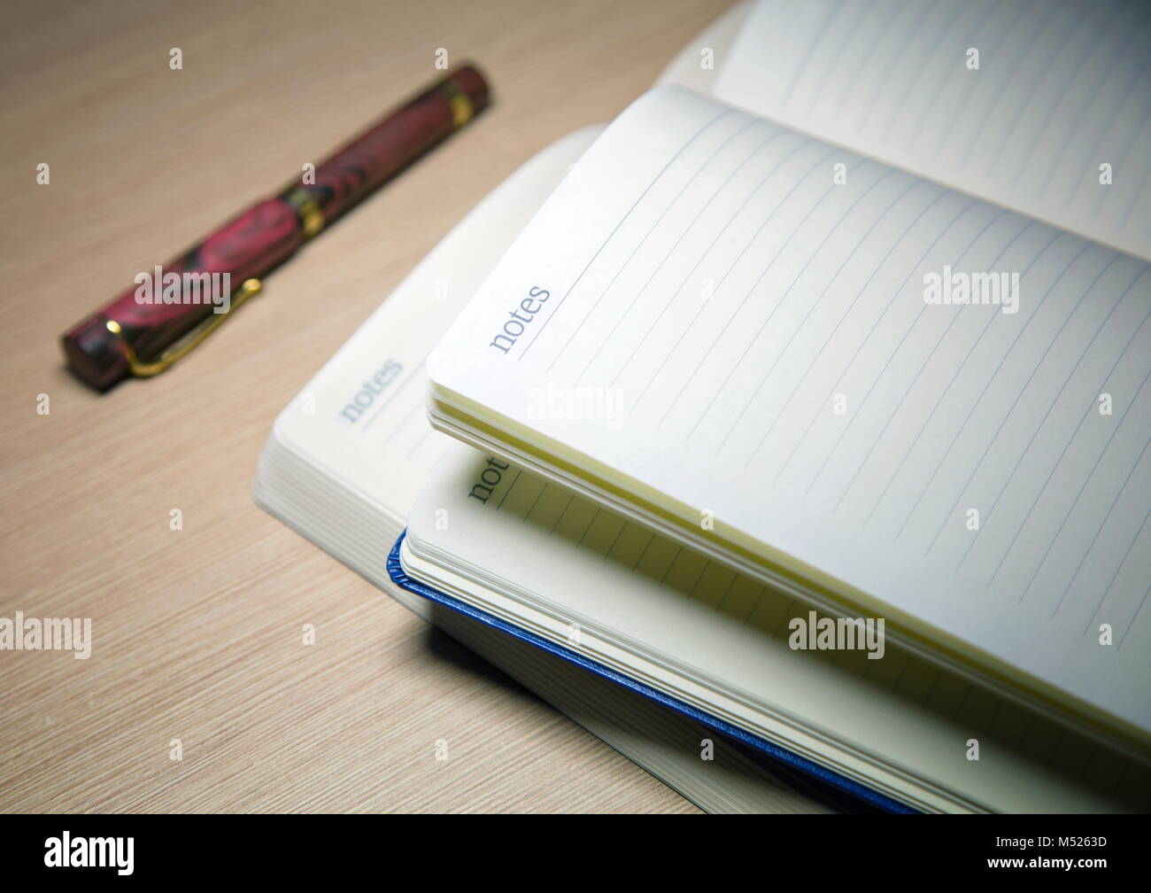 page diary and fountain pen closeup on table Stock Photo - Alamy