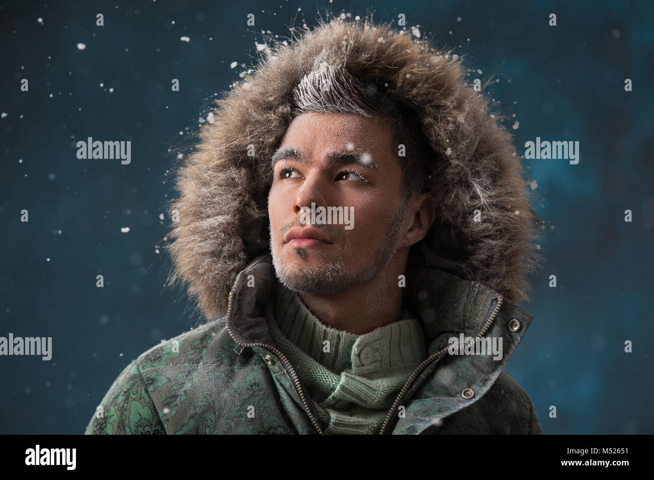 Male model posing in snow hi-res stock photography and images - Alamy