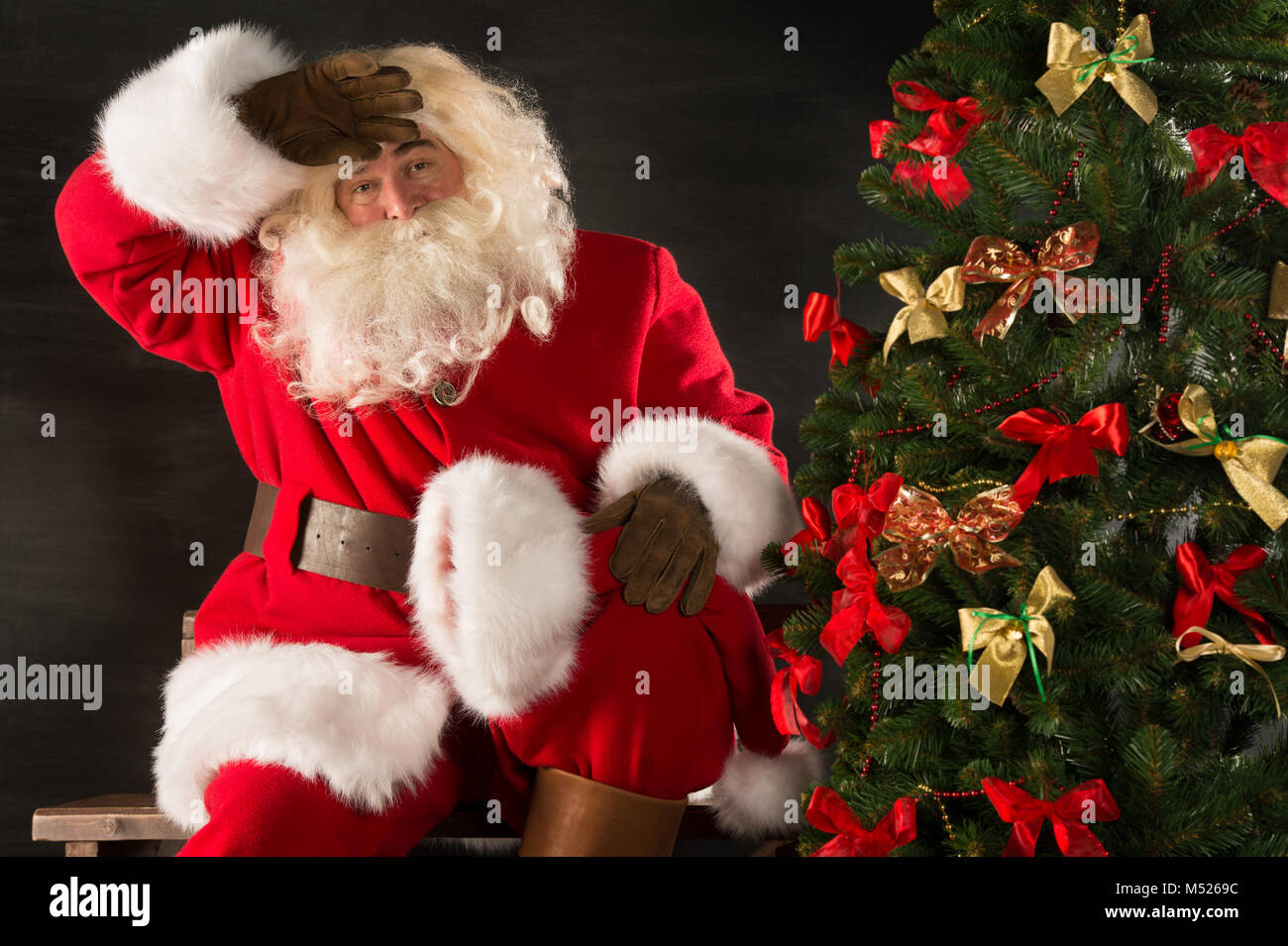 Santa claus distributing gifts hi-res stock photography and images - Alamy