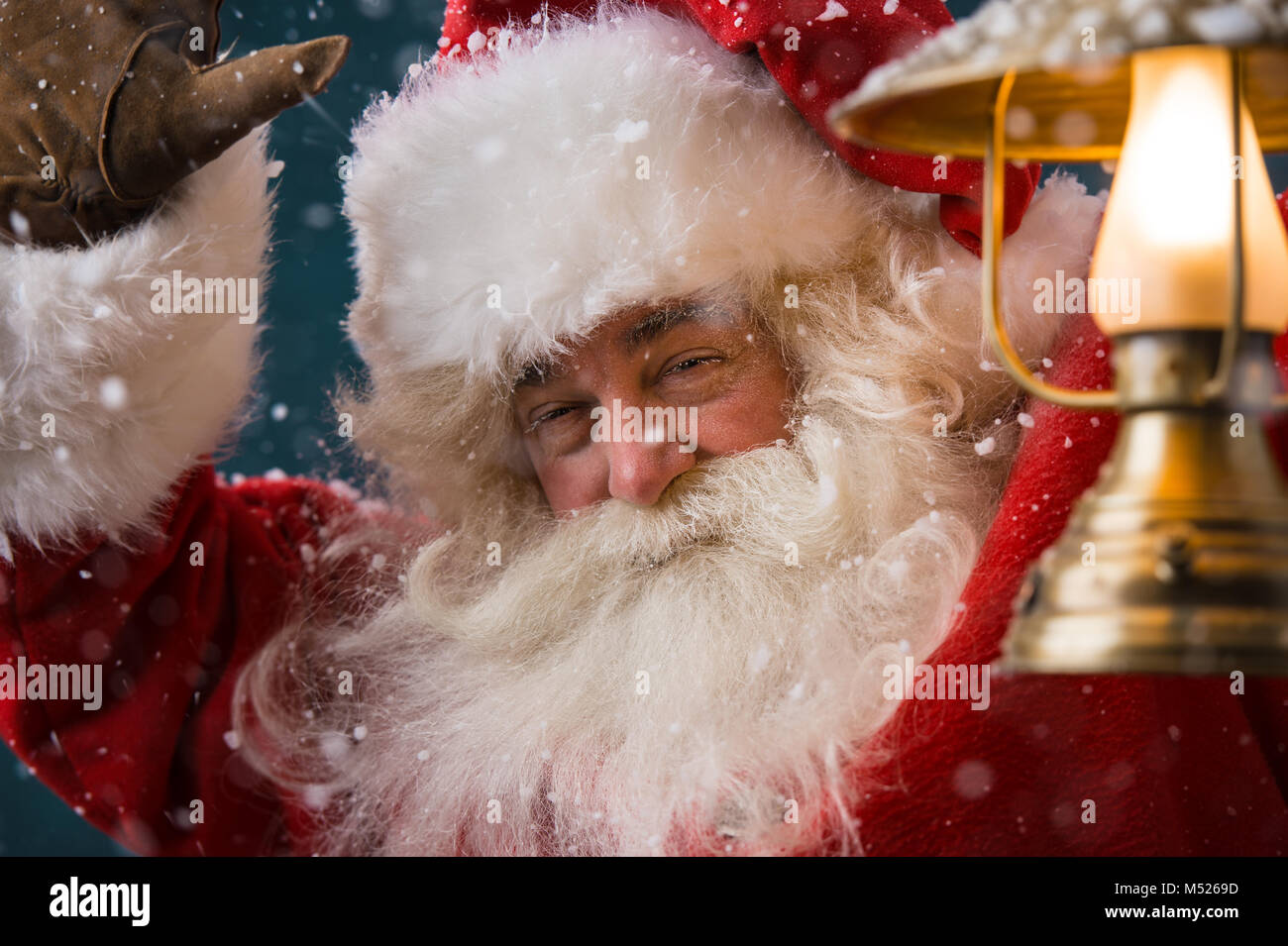 Santa claus holding shining lamp hi-res stock photography and images ...