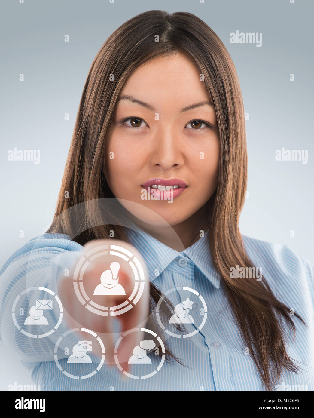 Asian business woman pressing social media icon Stock Photo - Alamy