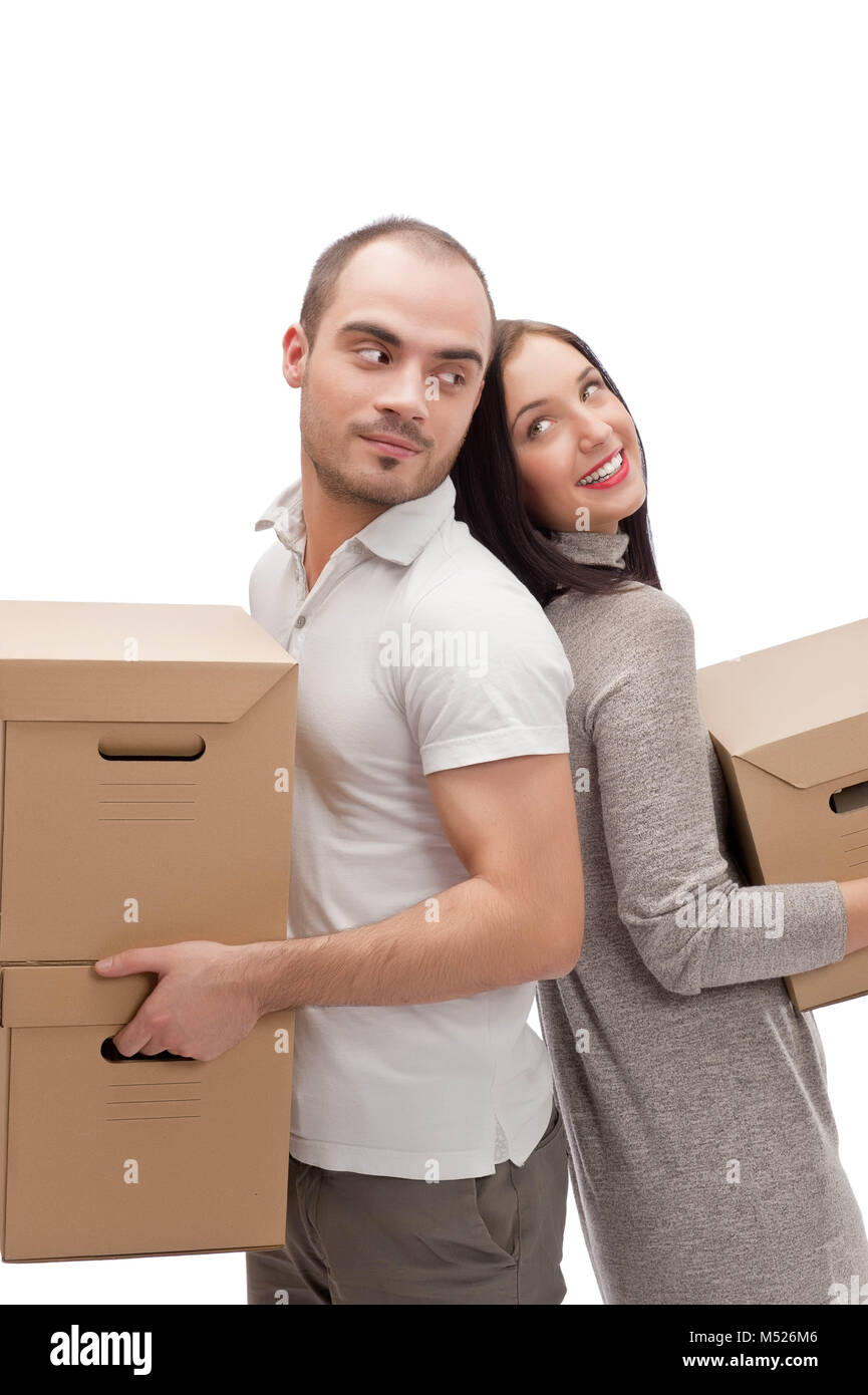 Young couple carrying cardboard boxes for their new home Stock Photo ...