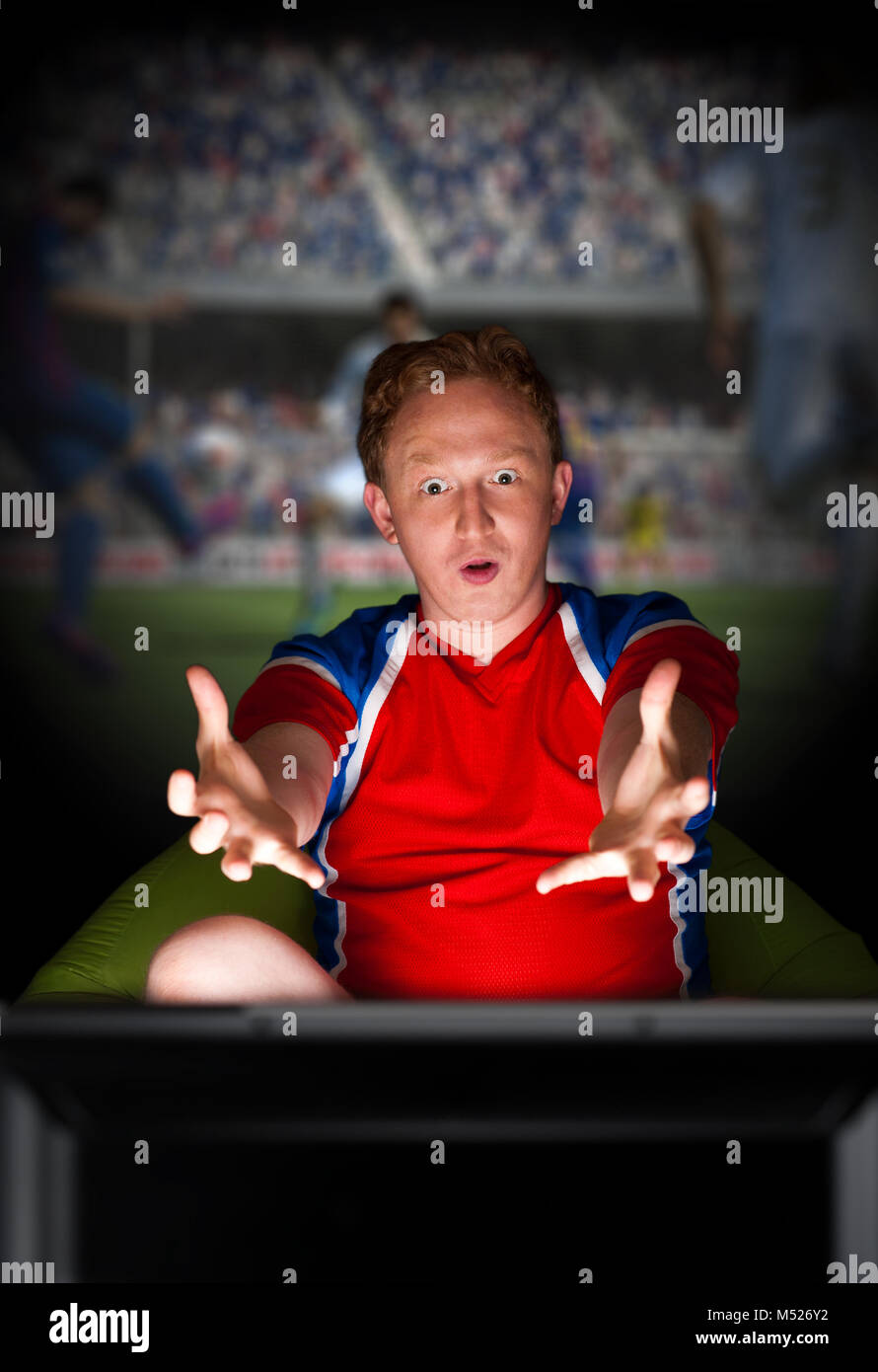 Closeup portrait of young man wearing sportswear fan of football team ...
