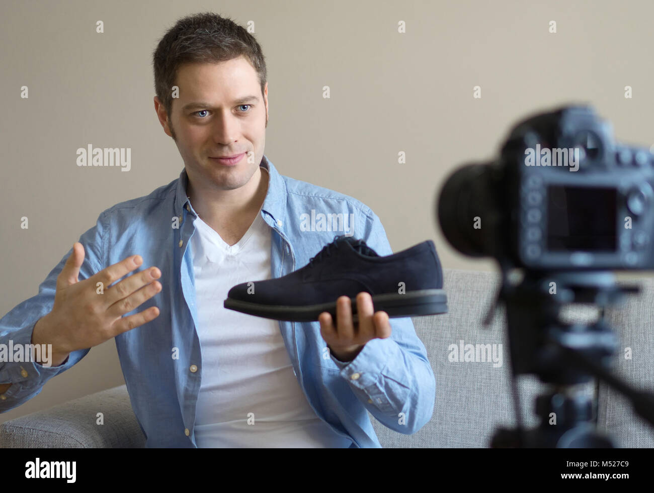 Handsome man making video blog about fashion Stock Photo - Alamy