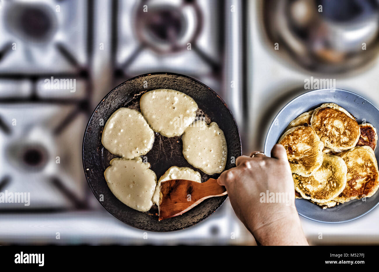 Woman making pancakes in frying hi-res stock photography and images - Alamy