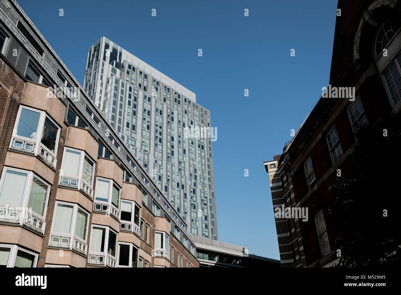 Tall buildings with shadow windows hi-res stock photography and images ...
