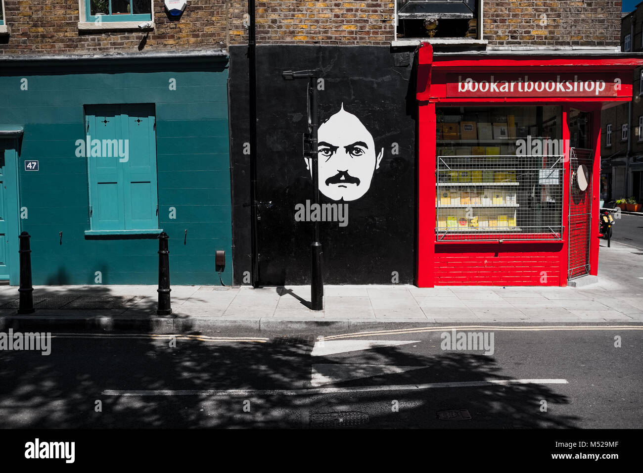 Negative space street art on a wall in East London, England Stock Photo ...