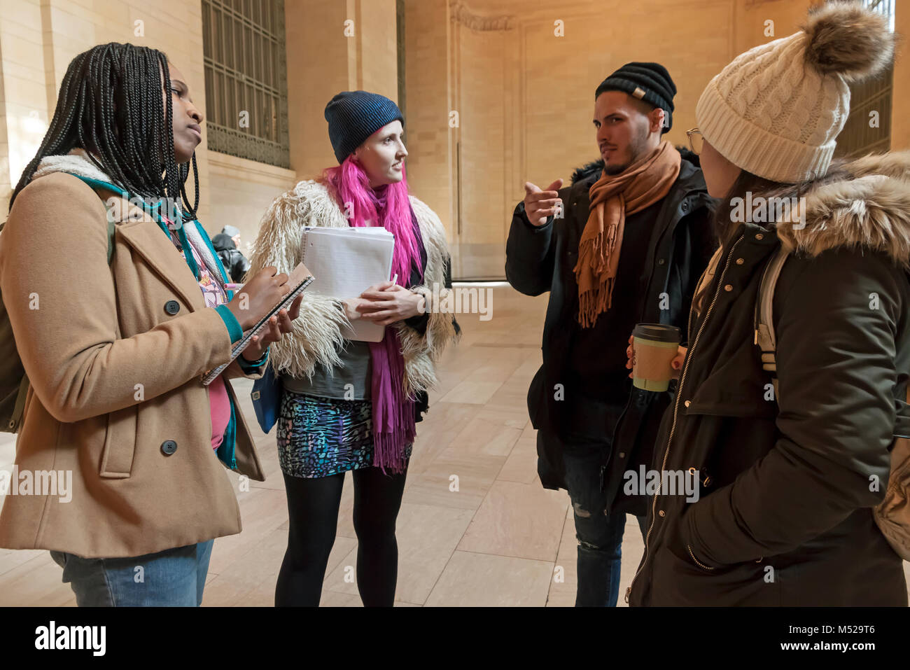 Young student taking notes interview hi-res stock photography and ...