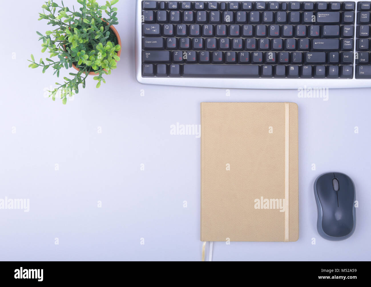 Modern office table with keyboard, phone, notebook on white background ...