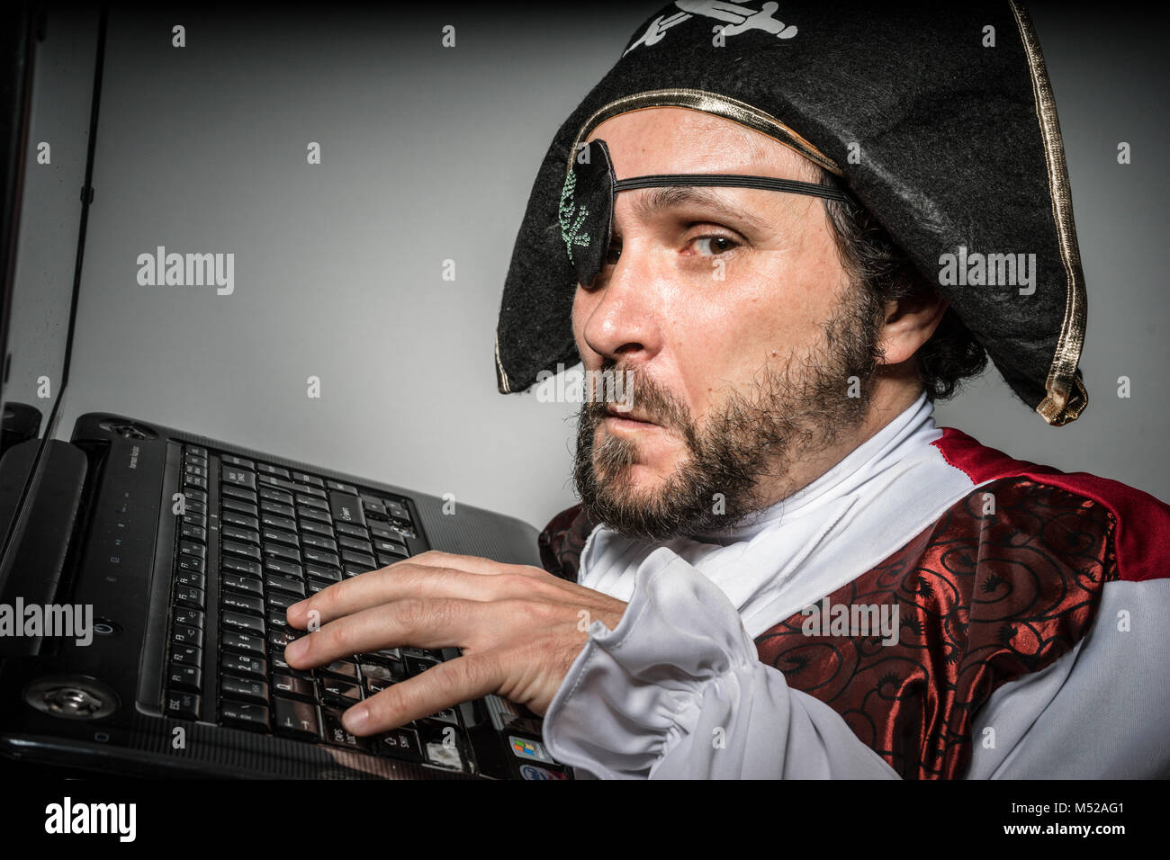 Attack, hacker, cyber criminal with pirate clothes, attempt to hack a ...