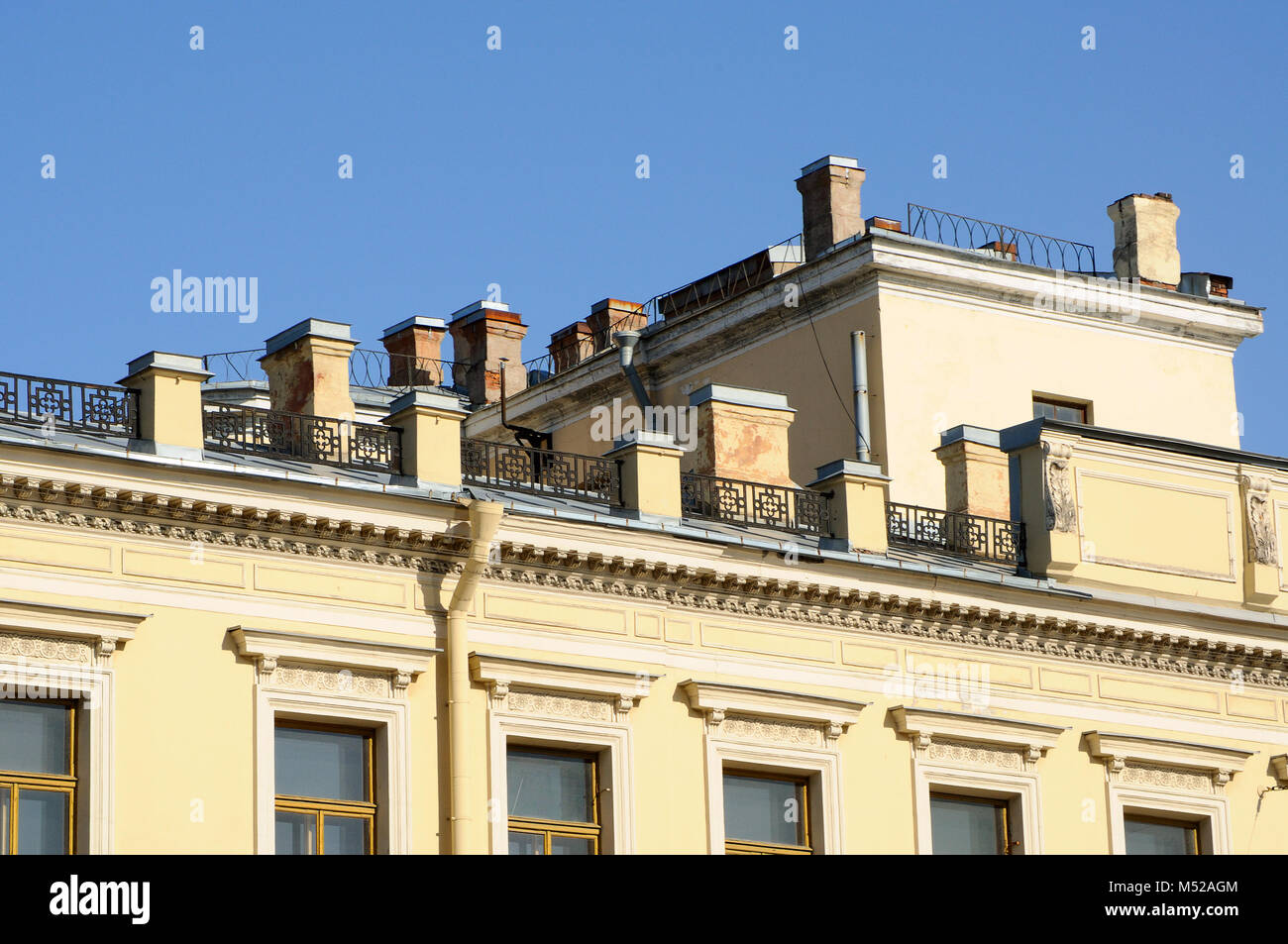 Chimneys on the roof of an old house in St. Petersburg, Russia Stock ...