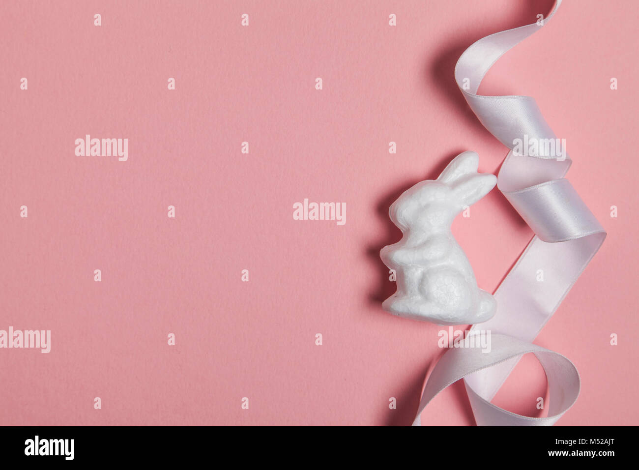 Pastel pink easter bunny background Stock Photo - Alamy