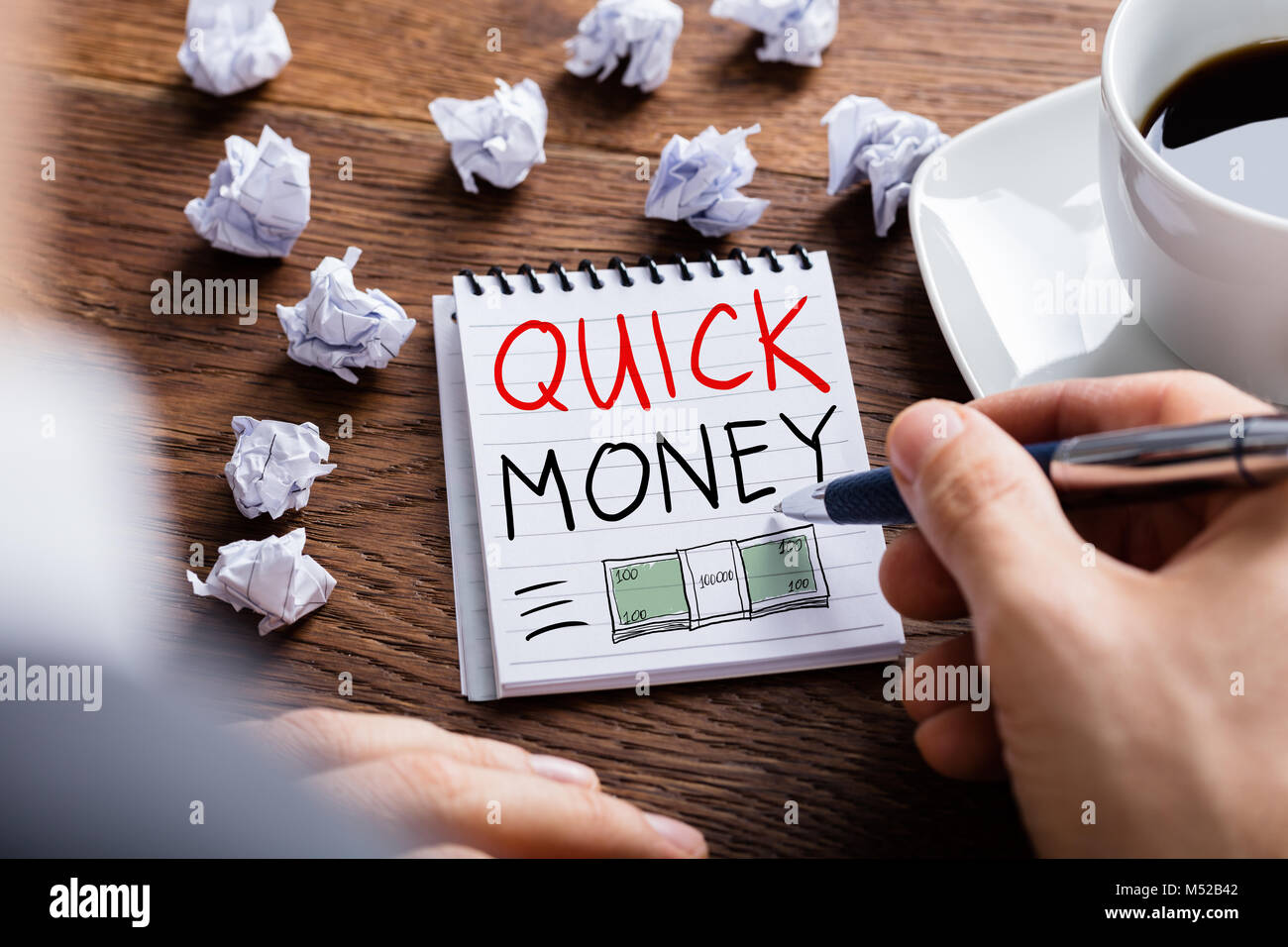 Man Drawing Quick Money Concept In Notepad Stock Photo - Alamy