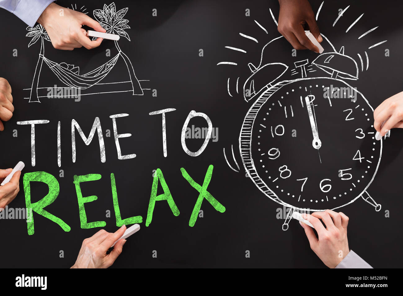 Hands Drawing Time To Relax Words On Blackboard Stock Photo - Alamy