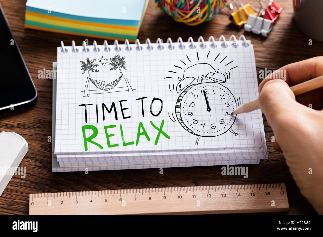 Man Drawing Time To Relax Words In Notepad Stock Photo - Alamy