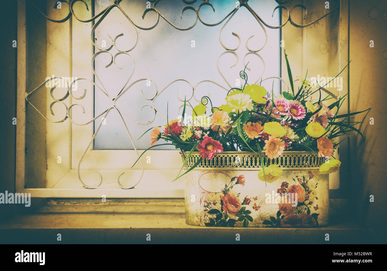 Pot of flowers on the window Stock Photo - Alamy