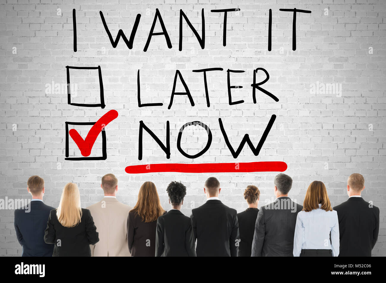 People Looking At I Want It Now Words On Wall Stock Photo - Alamy