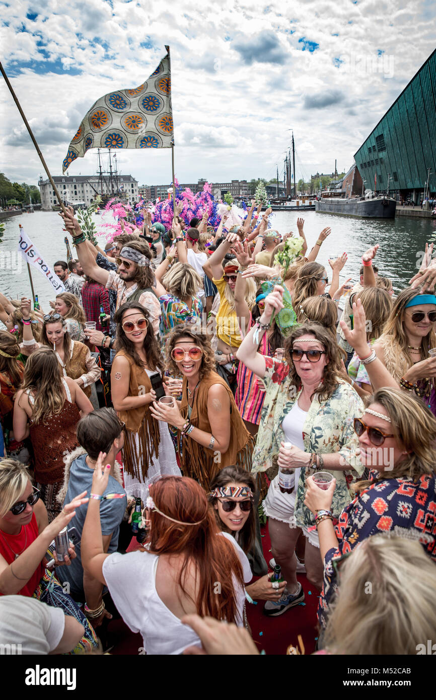 Participants packed on one of the canal boats dancing with music during ...