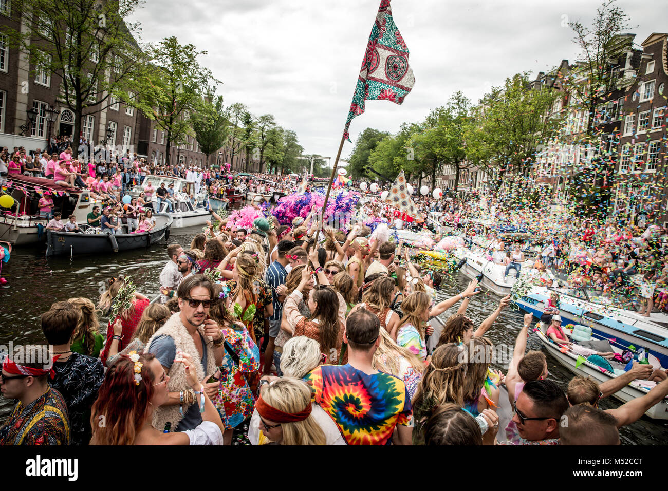 Participants packed on one of the canal boats dancing with music during ...