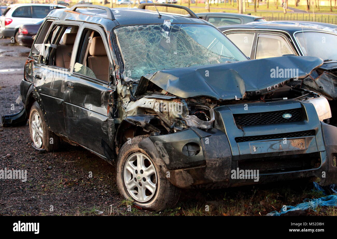 The consequences of a frontal collision of cars Stock Photo - Alamy