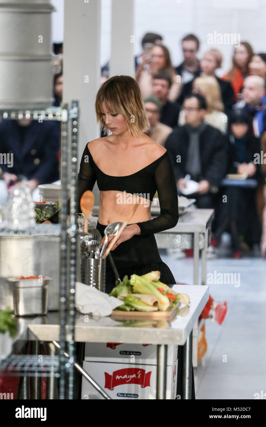 A model seen talking a lunch break next to the runway during the Molly ...
