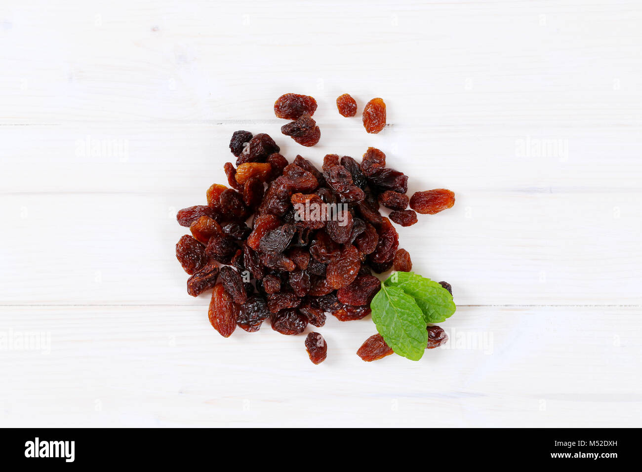 pile of sweet raisins on white background Stock Photo - Alamy