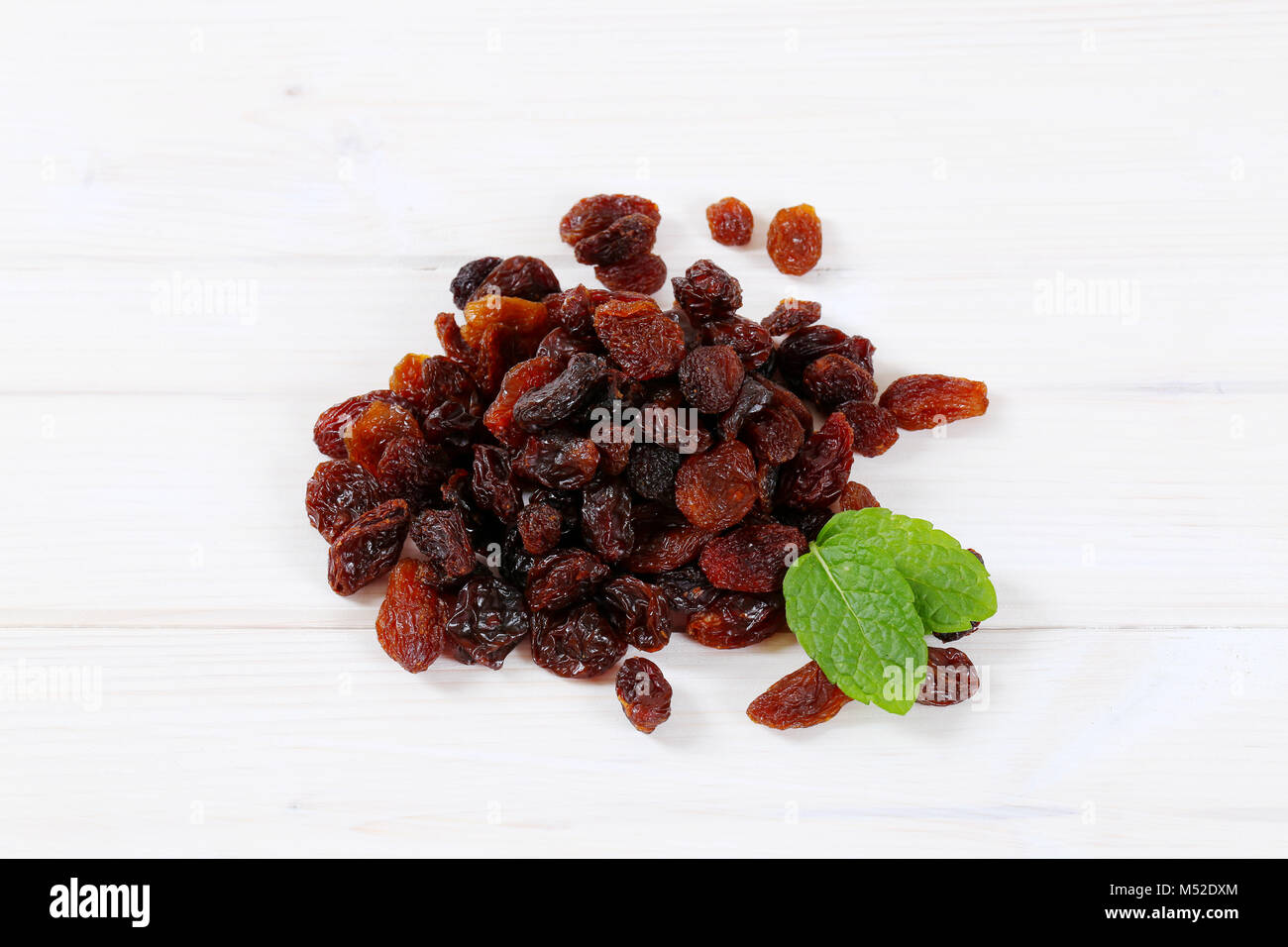 pile of sweet raisins on white background Stock Photo - Alamy