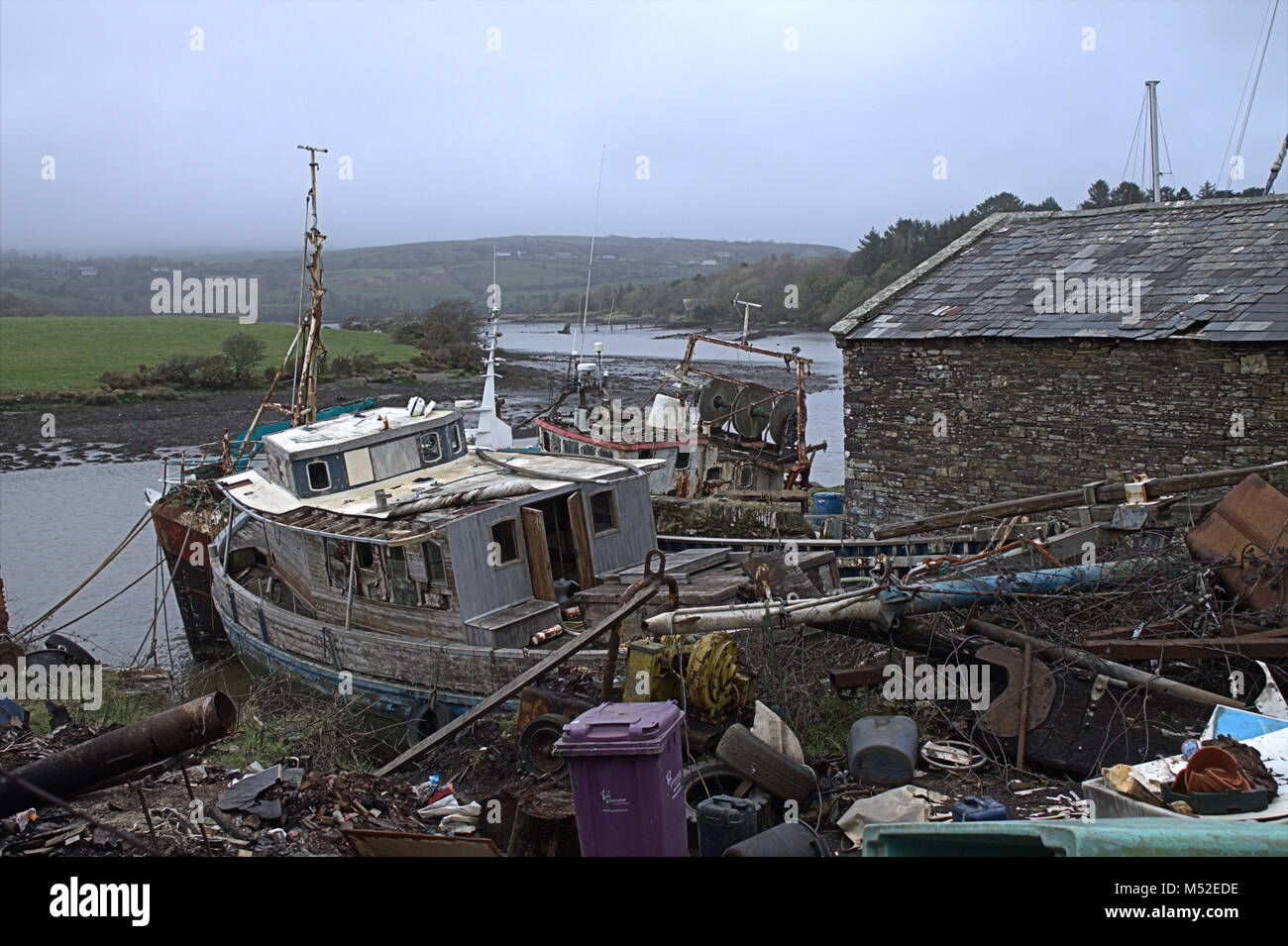 Rotting waste and garbage littering the shoreline of an estuary Stock ...