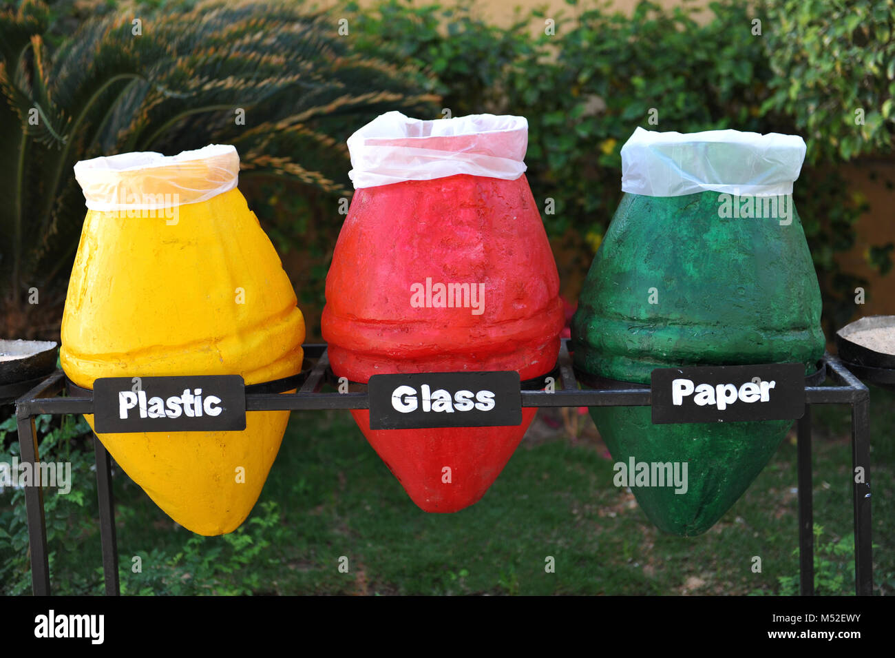 colored containers for recycling paper, plastic glass Stock Photo - Alamy