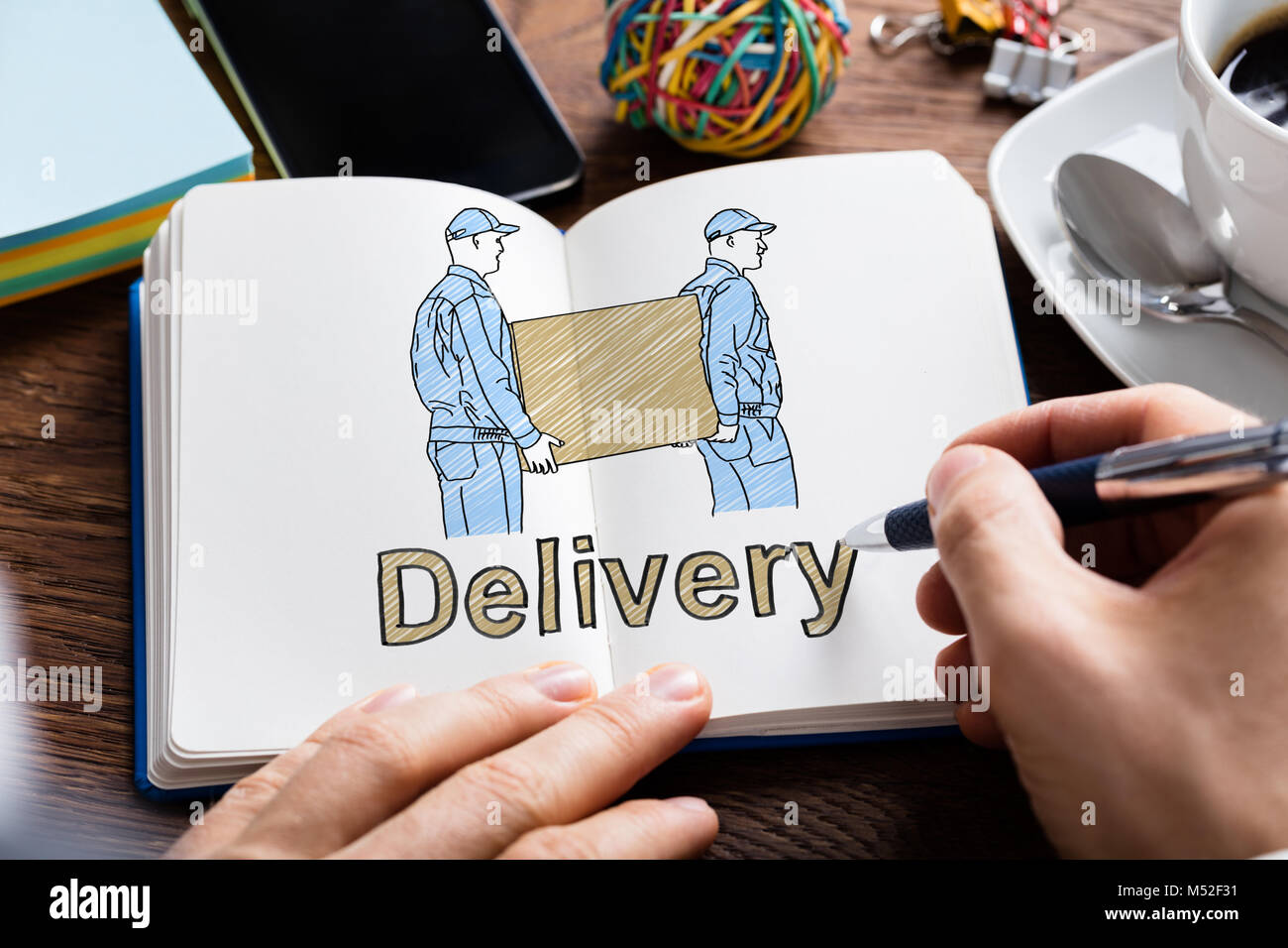 Close-up Of A Person's Hand Drawing Delivery Concept With Movers ...