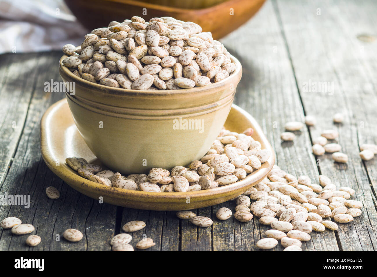 Dried borlotti beans on old wooden table Stock Photo - Alamy