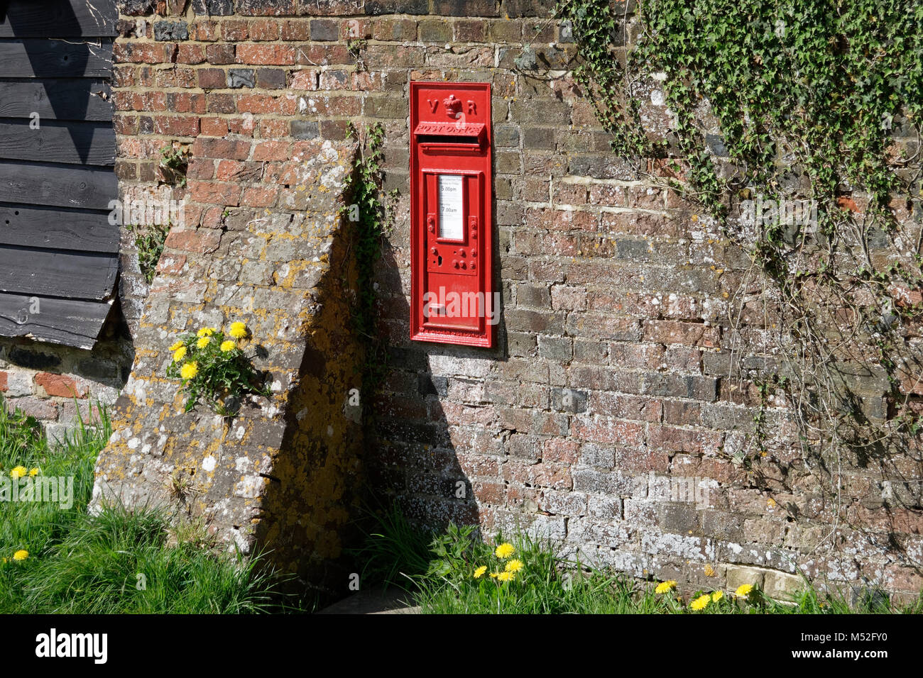 Red Post Box in wall,Normandy,Surrey Stock Photo - Alamy