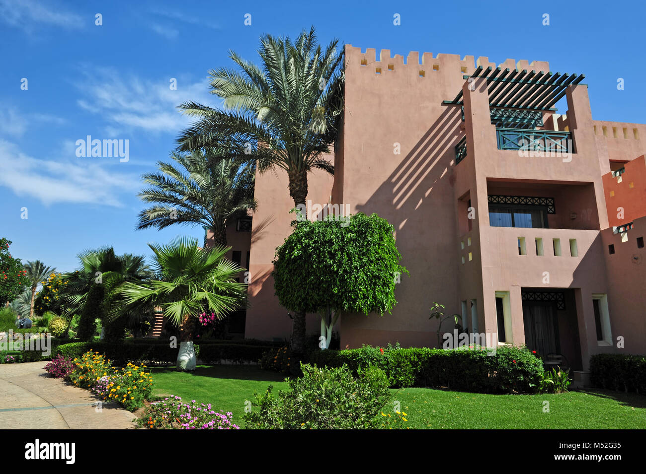 Beautiful garden at hotel resort and building in traditional arabic ...