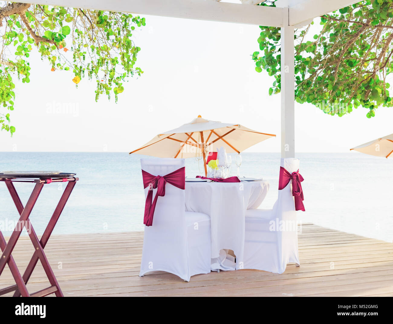 festive table in the gazebo at sunset caribbean dominican Stock Photo ...
