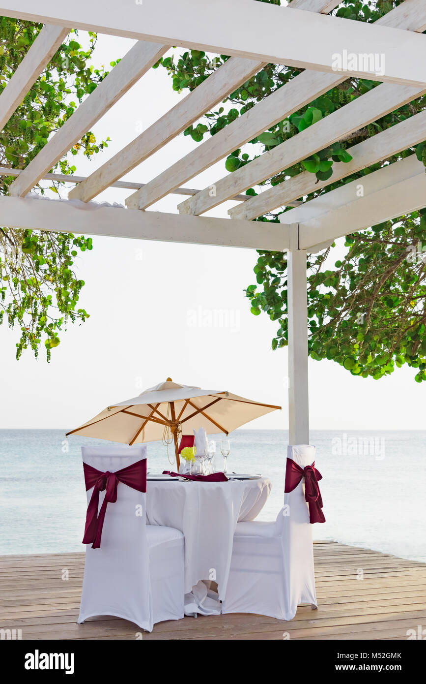 festive table in the gazebo at sunset caribbean dominican Stock Photo ...