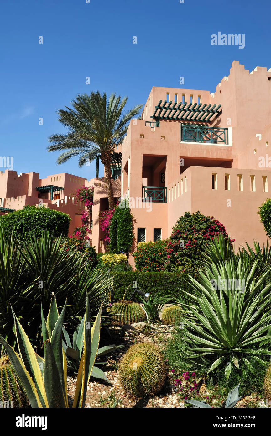 Beautiful garden at hotel resort and building in traditional arabic ...