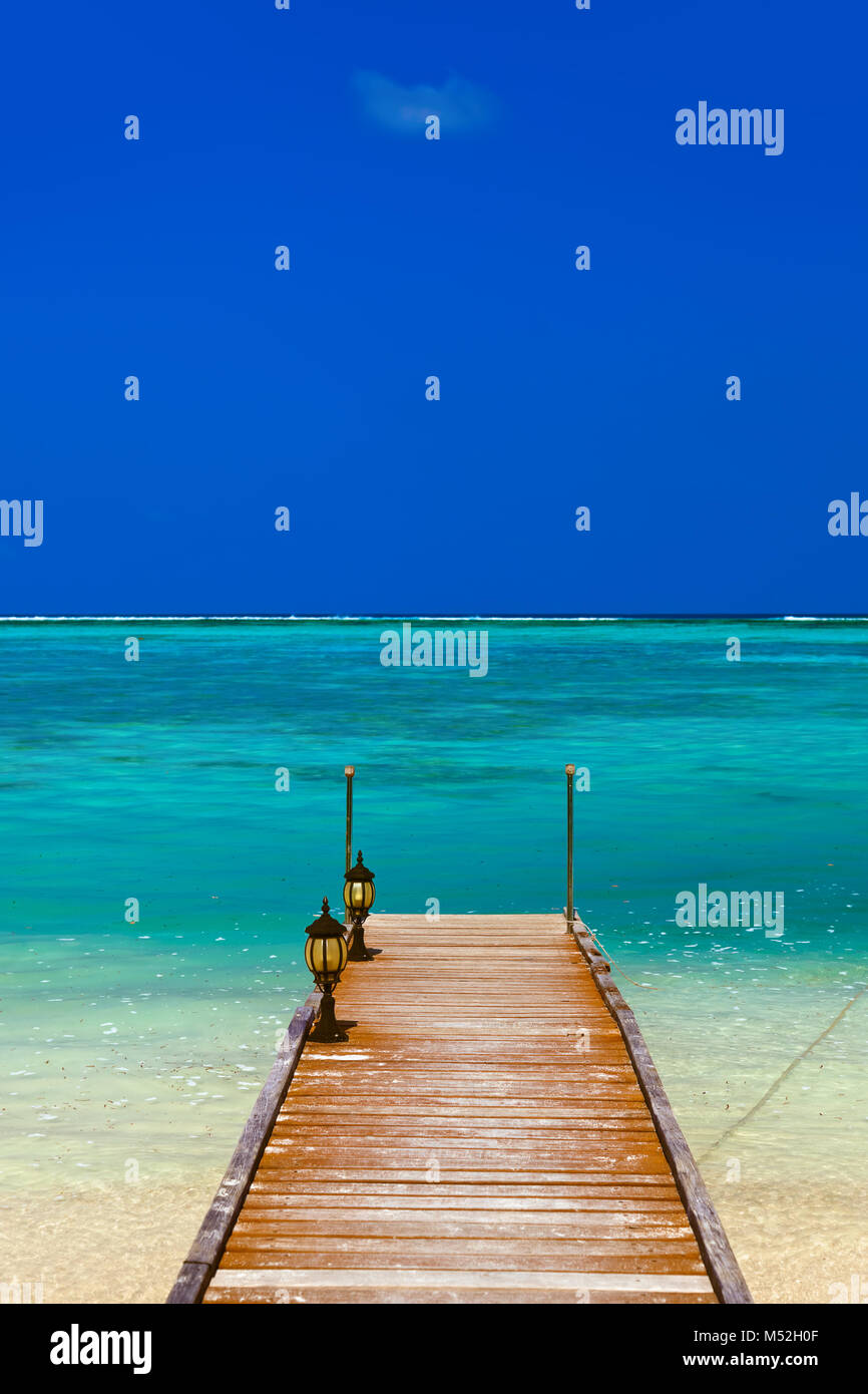 Jetty on Maldives island Stock Photo - Alamy
