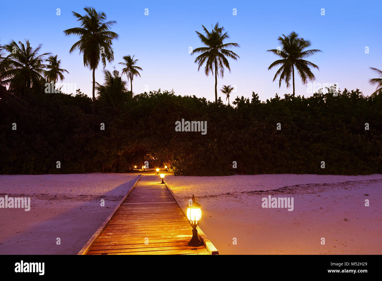 Jetty beach at sunset - Maldives Stock Photo - Alamy